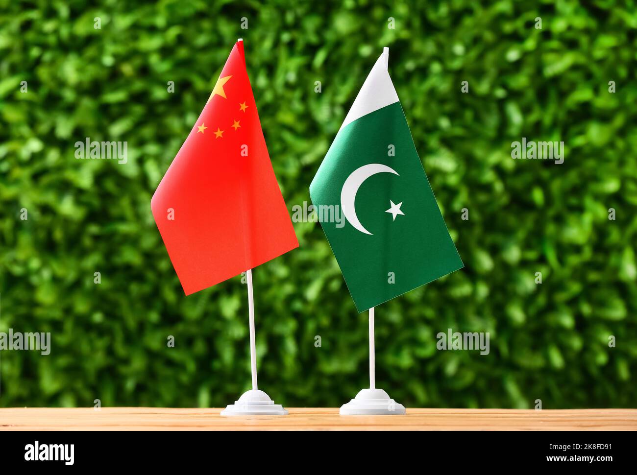 National flags of China and Pakistan on table outdoors Stock Photo - Alamy