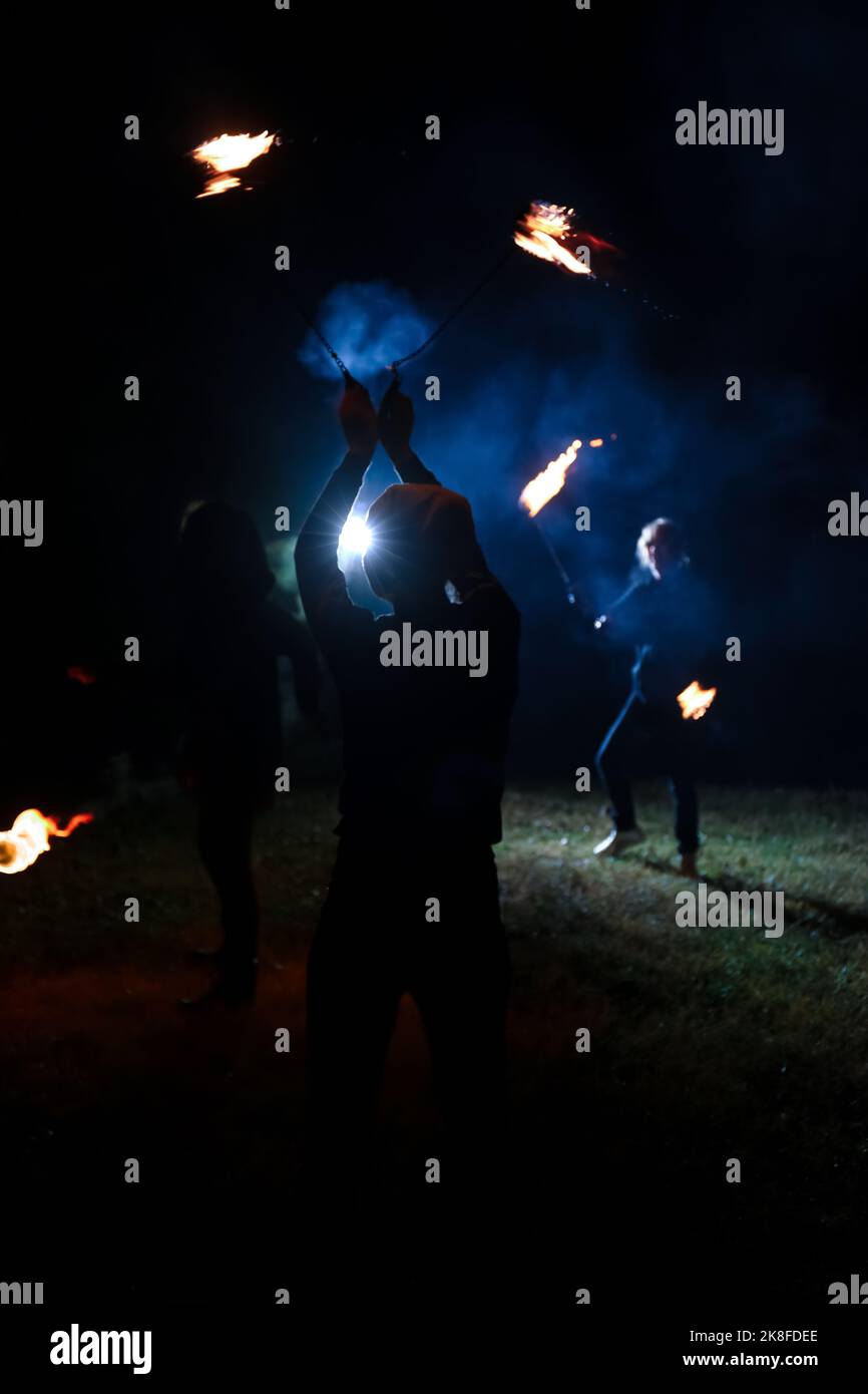 Amazing fire show artists outdoors Stock Photo - Alamy