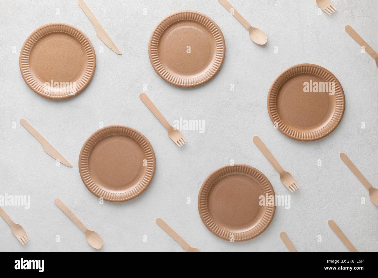 Pattern made of Eco plates and cutlery on white background Stock Photo ...