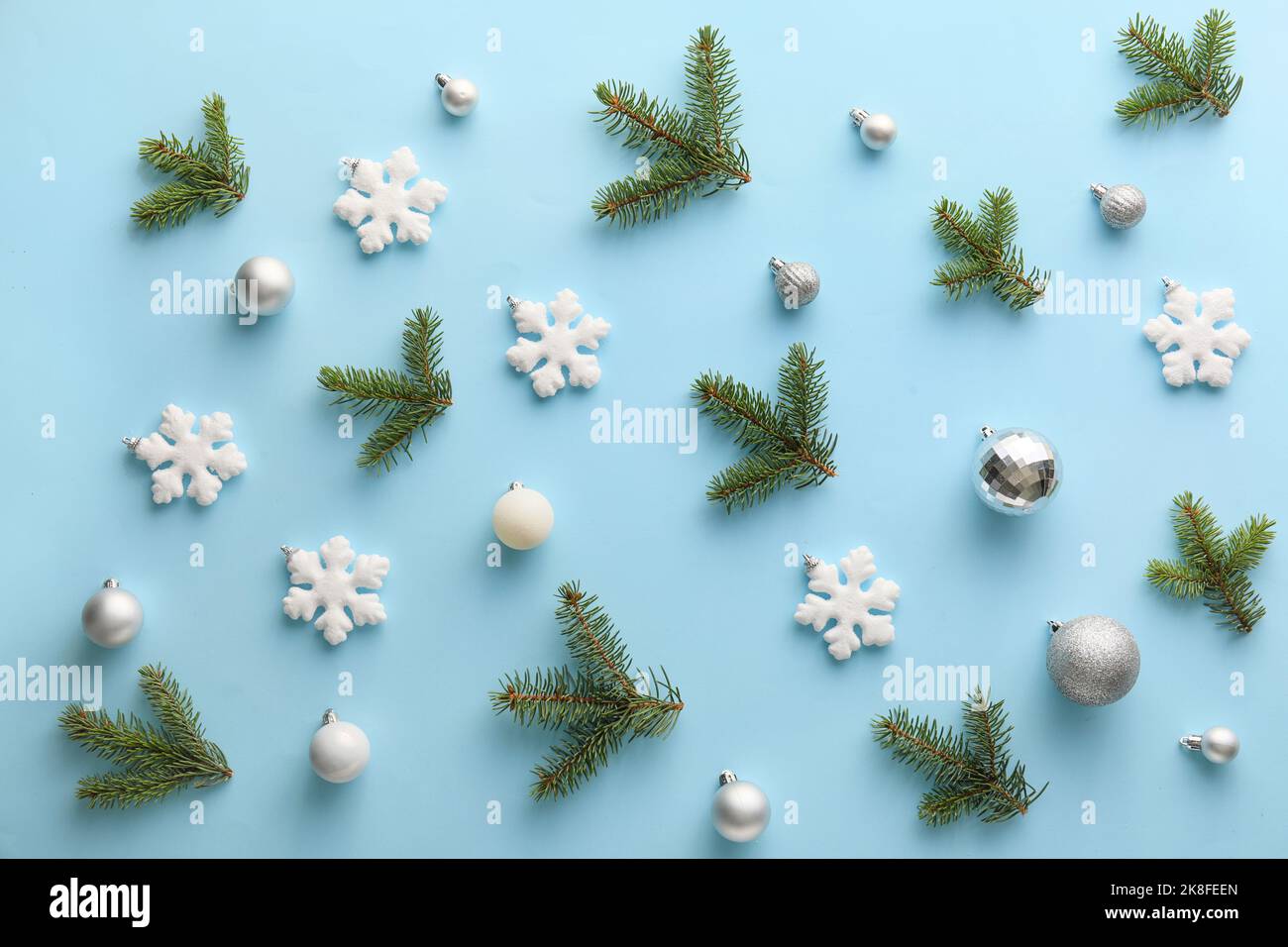 Beautiful Christmas decorations and fir branches on color background ...