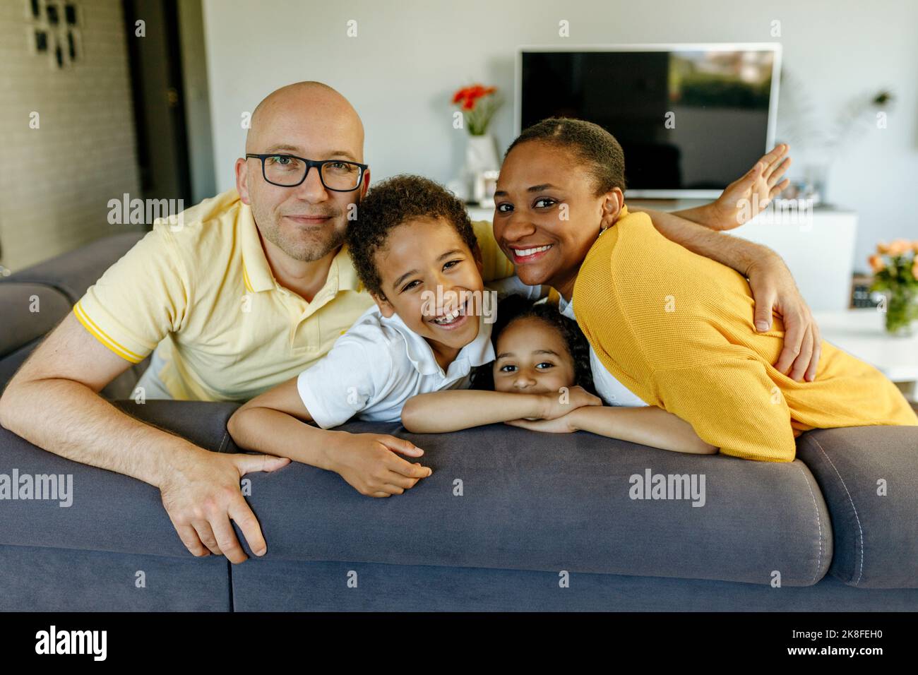 Happy family with home hi-res stock photography and images - Alamy
