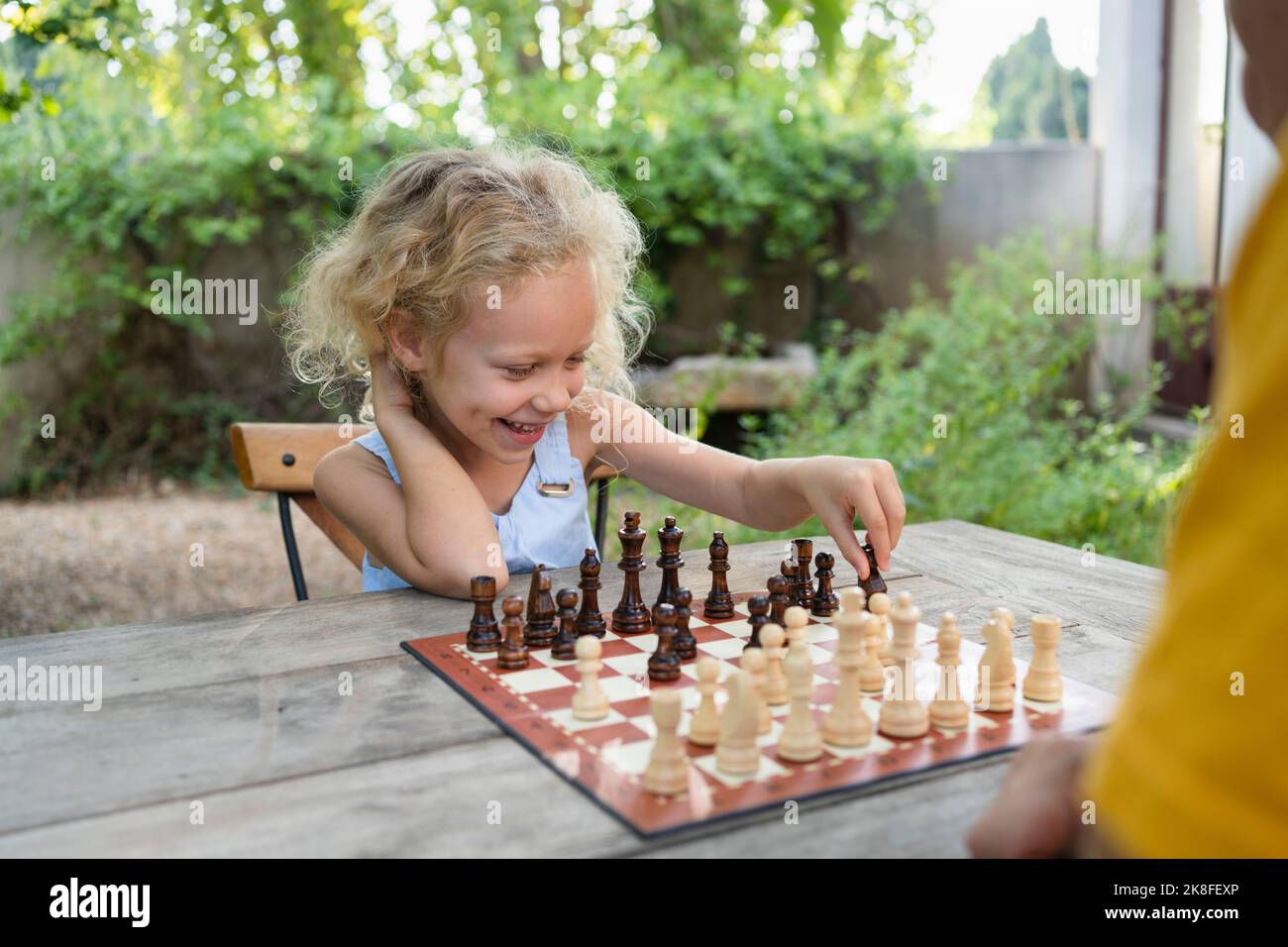 Two children playing chess hi-res stock photography and images - Alamy