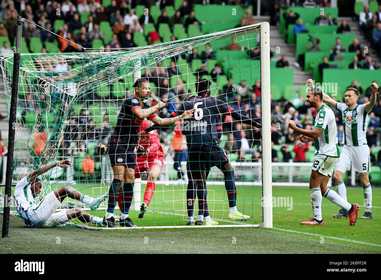 GRONINGEN - Armando Obispo looks defeated. Neraysho Kasanwirjo (L ...