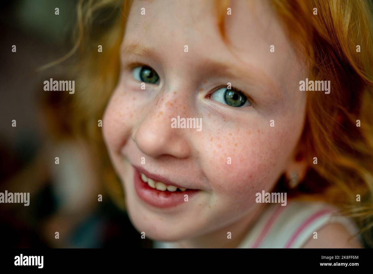 Smiling redhead girl with freckles on face Stock Photo - Alamy