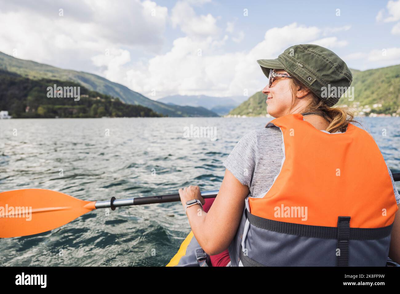 Smiling mature woman kayaking at lake Stock Photo - Alamy