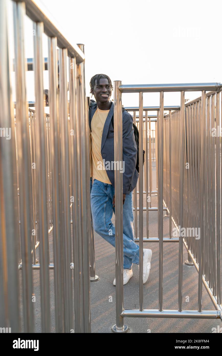 Young man leaning forward hi-res stock photography and images - Alamy