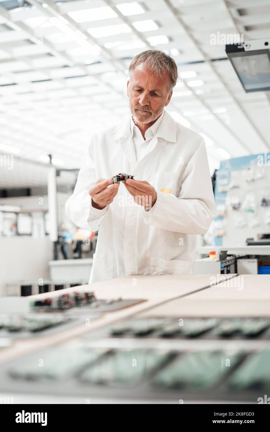 Engineer examining printing press hi-res stock photography and images ...