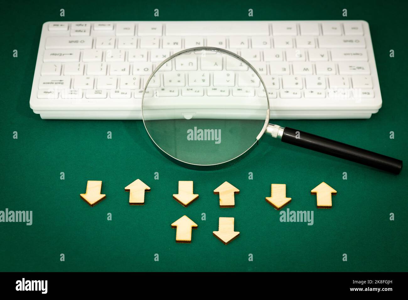 wooden arrows pointing up, magnifier and computer keyboard, Business ...