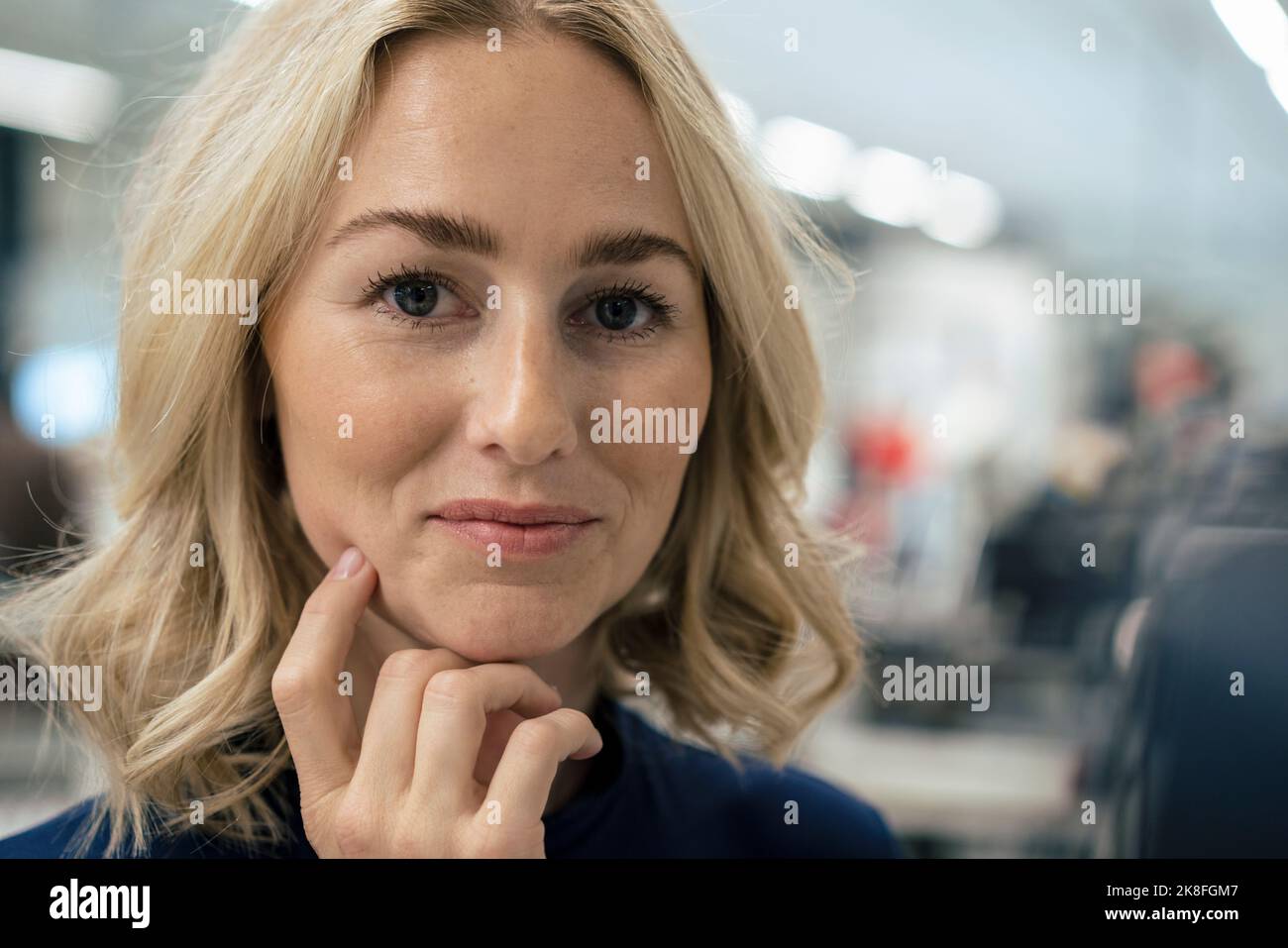 Woman touching chin one hand hi-res stock photography and images - Alamy