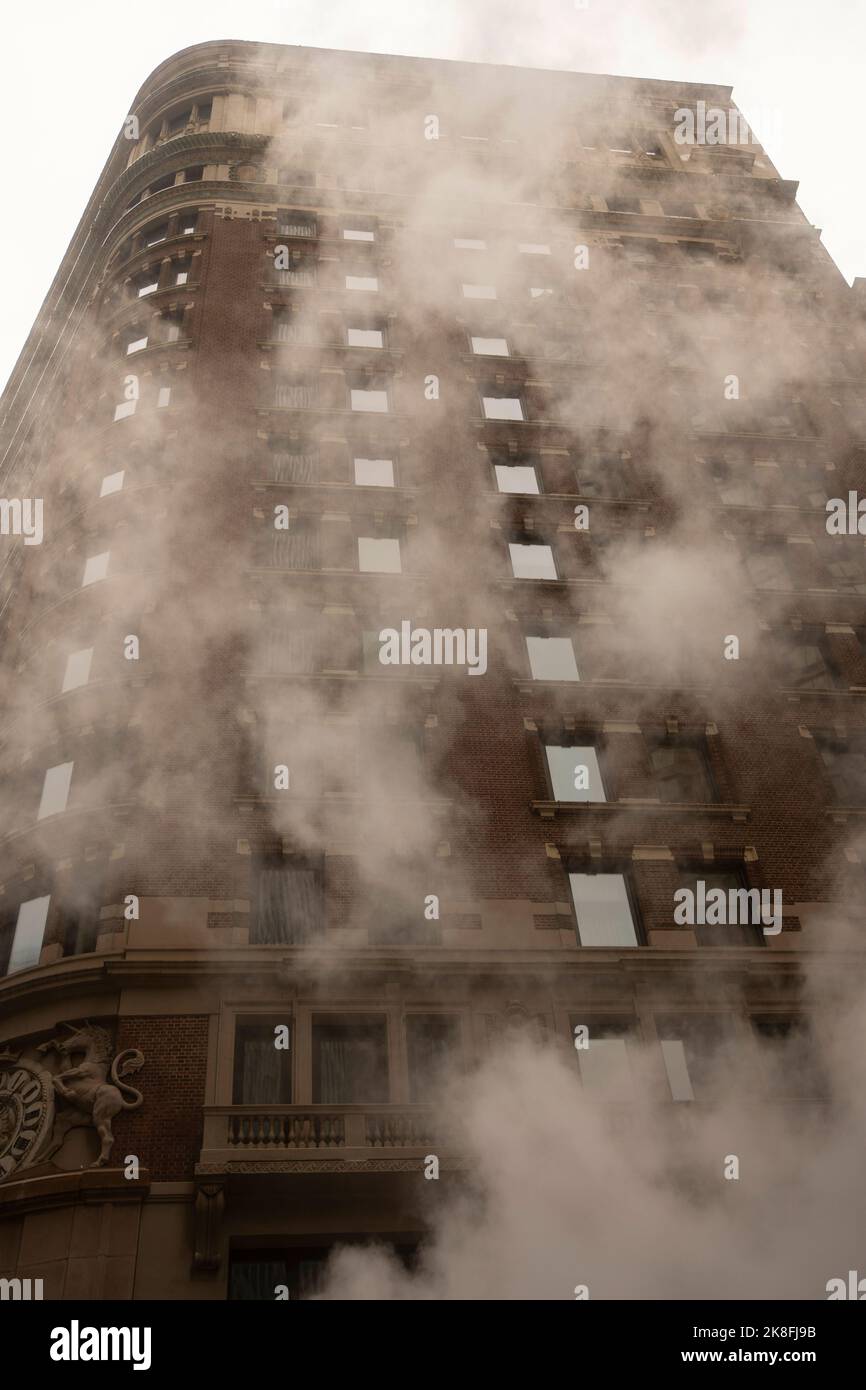 USA, New York, New York City, Smoke floating in front of building on ...