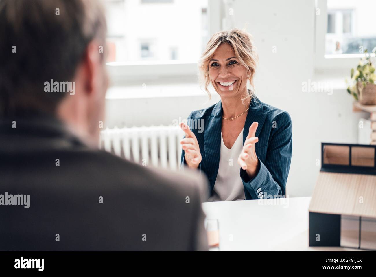 Talking to client hi-res stock photography and images - Alamy