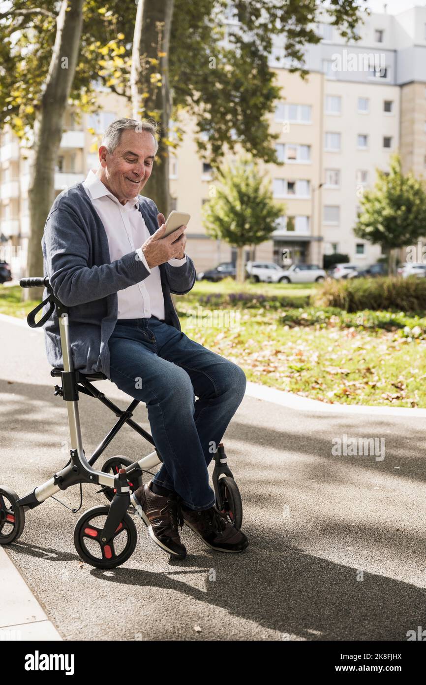 Walker sitting with their legs crossed hi-res stock photography and ...