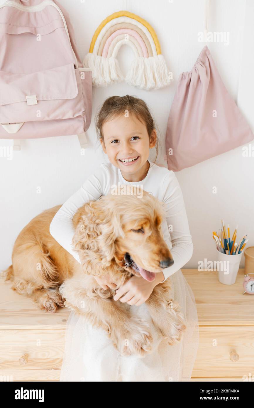 Child embracing dog hi-res stock photography and images - Alamy