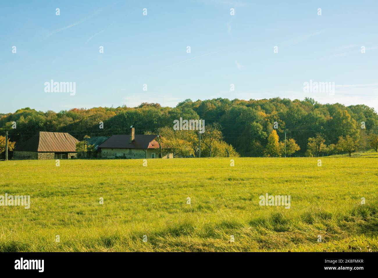 Peasant house in beautiful natural surroundings.Sunny autumn day. High ...