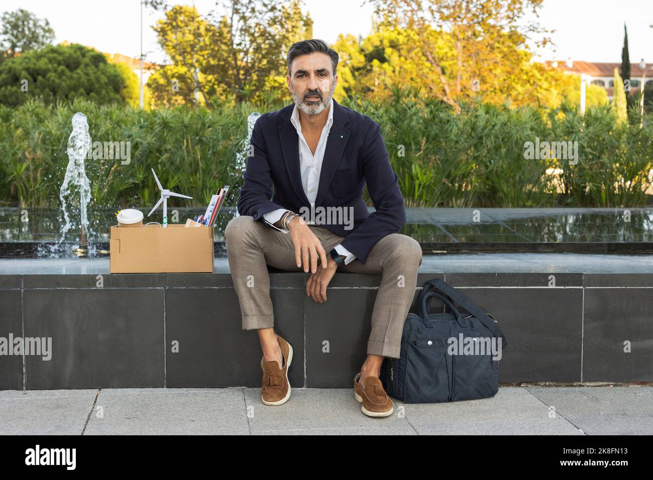 Male model sitting on box hi-res stock photography and images - Alamy