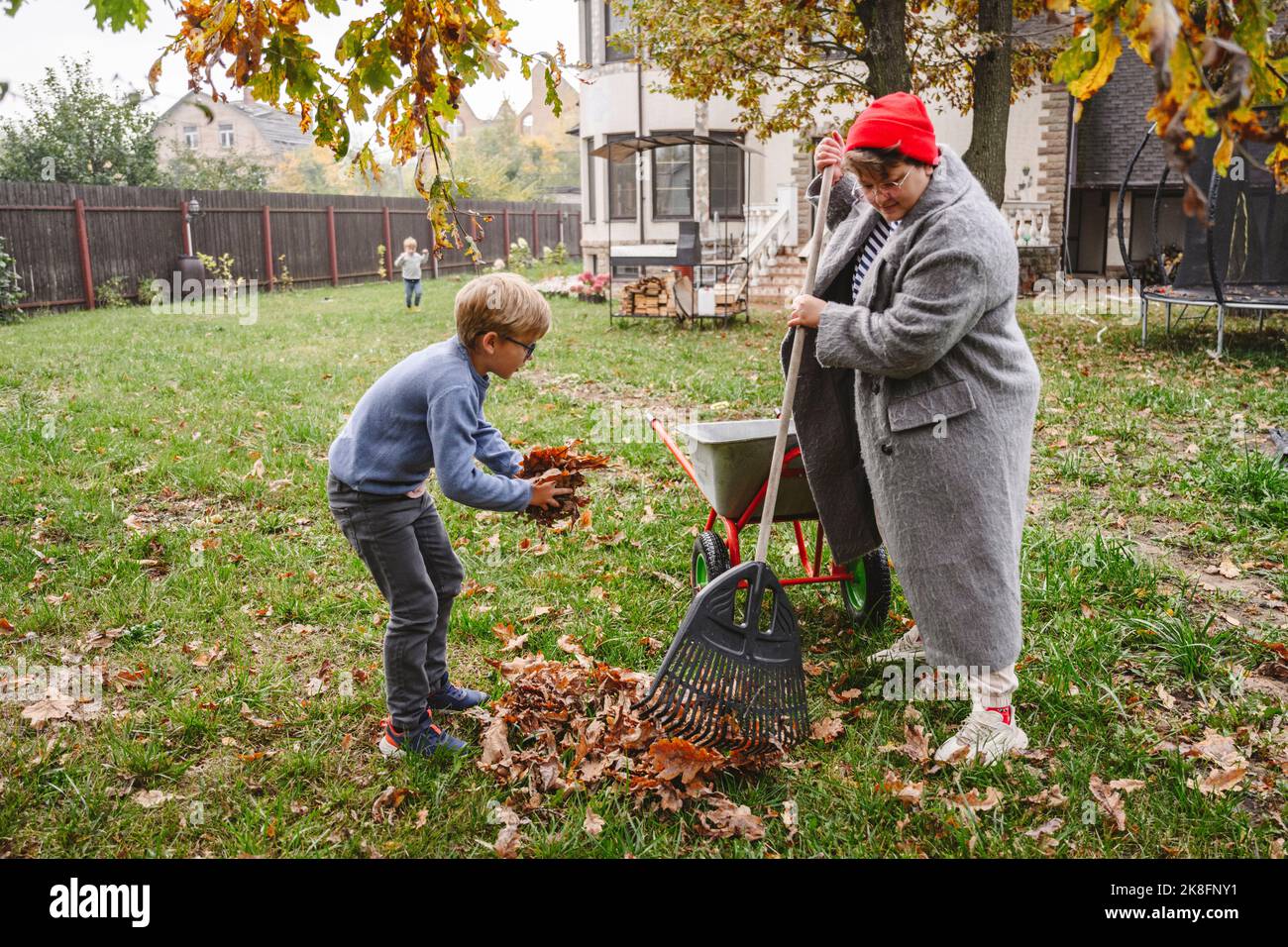 Family Raking Leaves