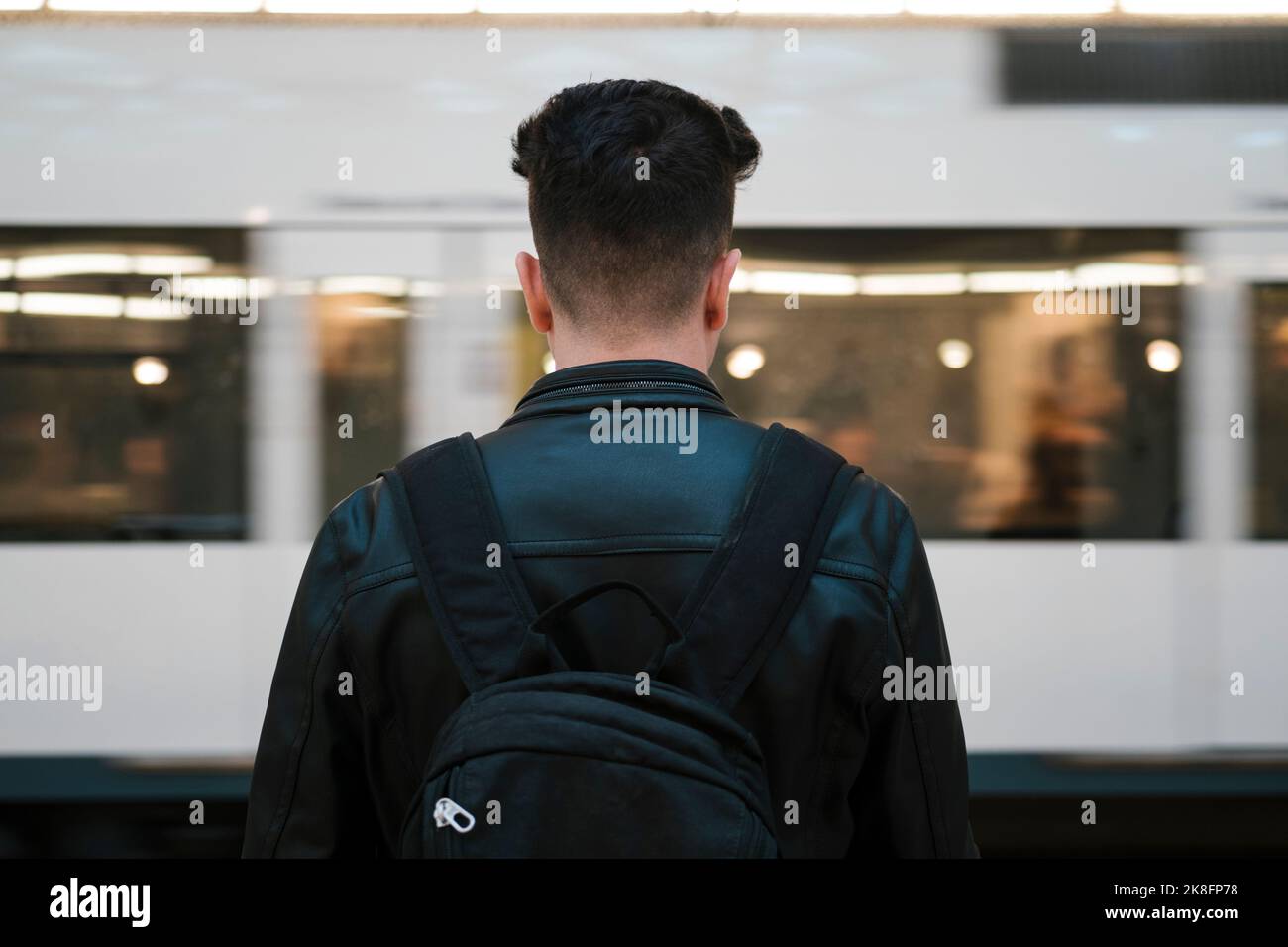 Male backpack station hi-res stock photography and images - Alamy