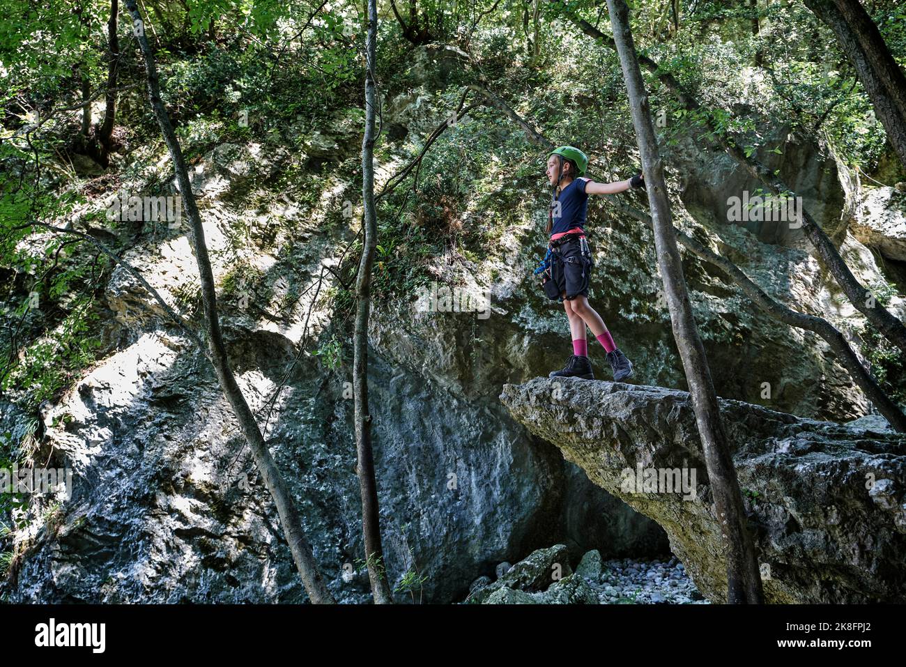 Girl standing arms akimbo hi-res stock photography and images - Alamy