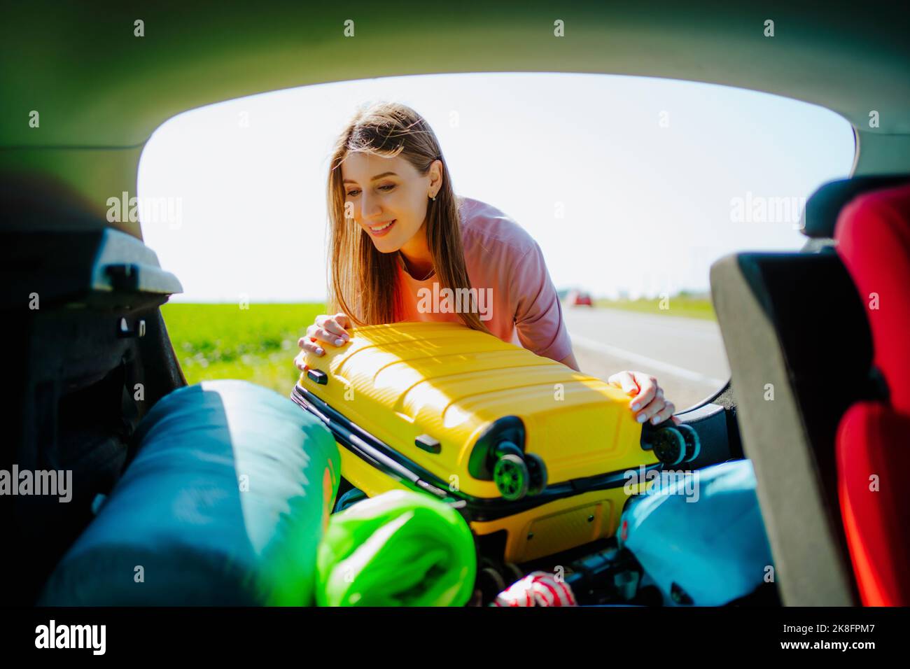 Woman loading trunk hi-res stock photography and images - Alamy