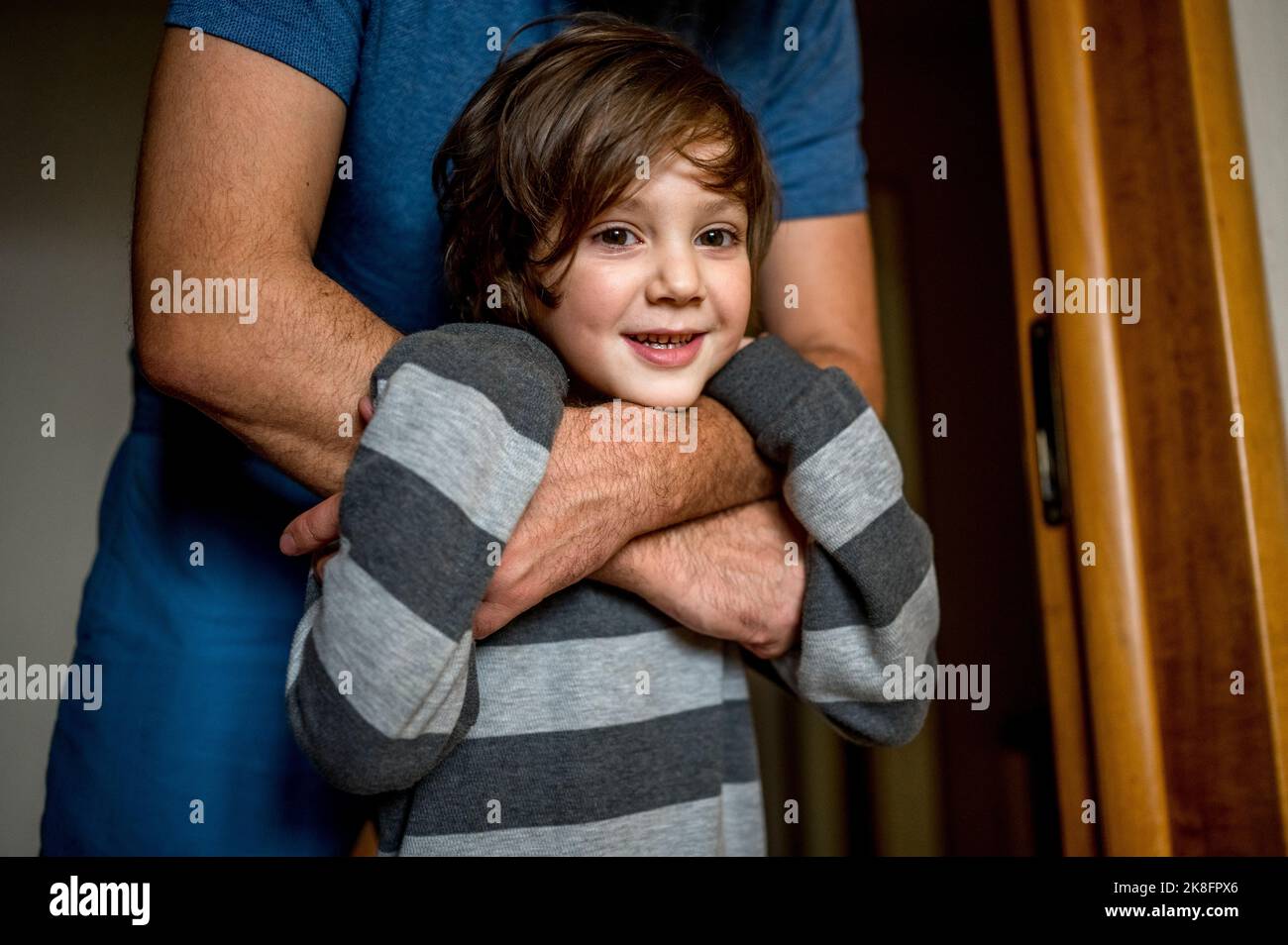 Happy boy from behind hi-res stock photography and images - Alamy