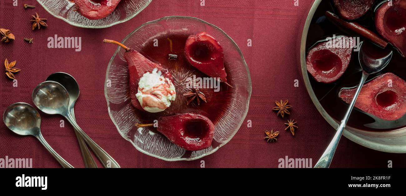 Narrow view of a serving of red wine poached pears with vanilla ice ...