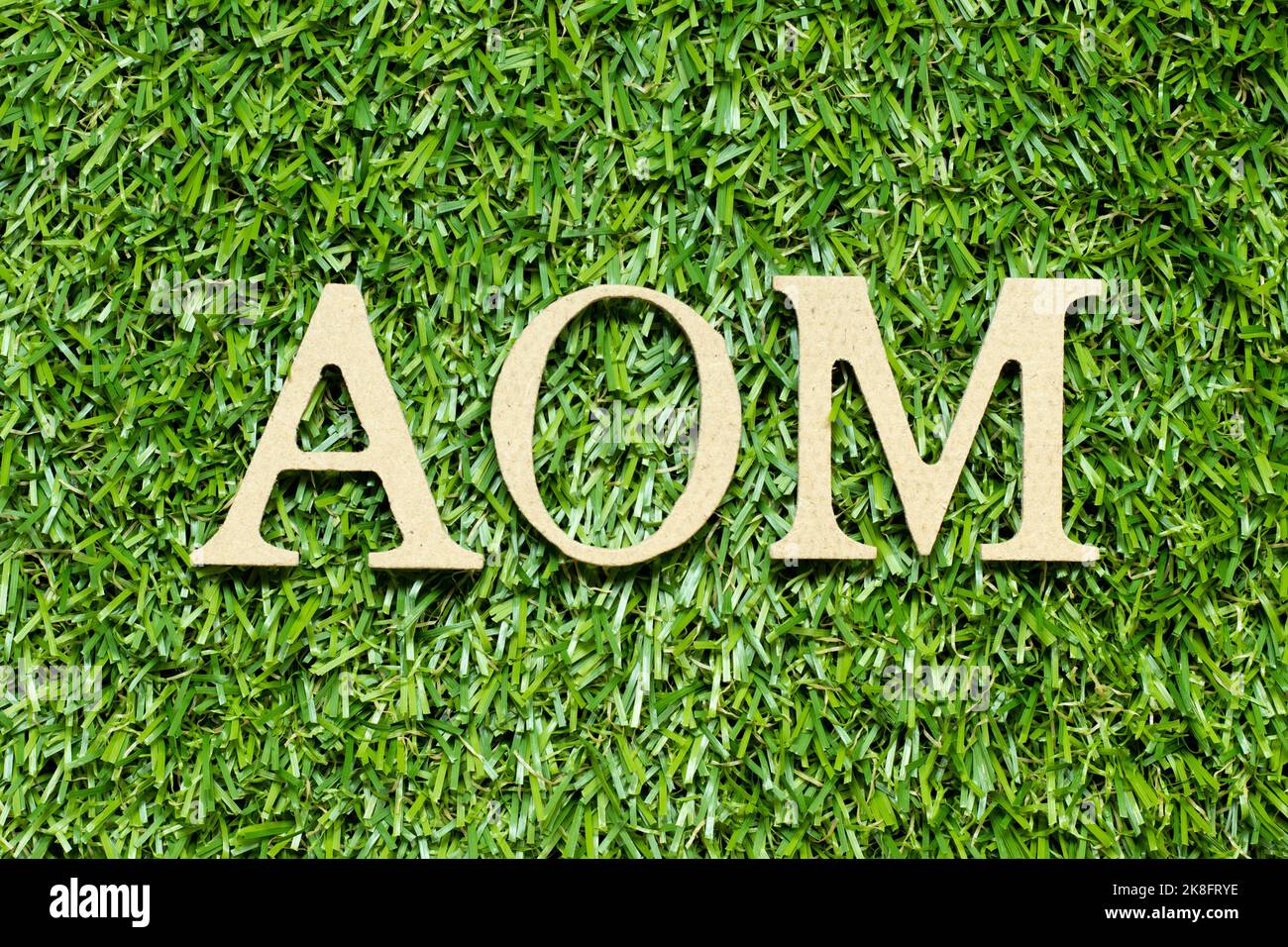 Wood alphabet letter in word AOM (Abbreviation of Advanced order ...