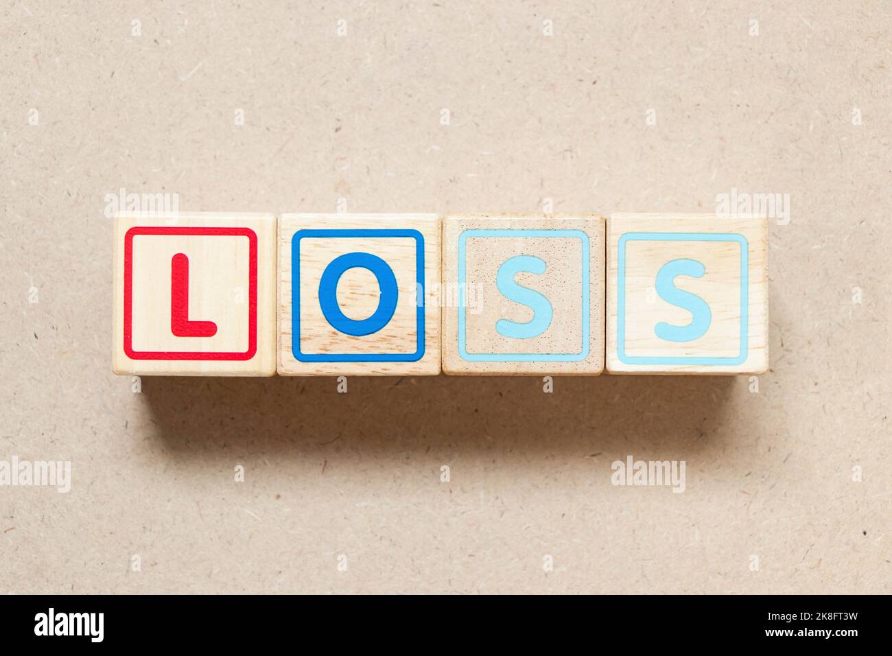 Color letter block in word loss on wood background Stock Photo - Alamy