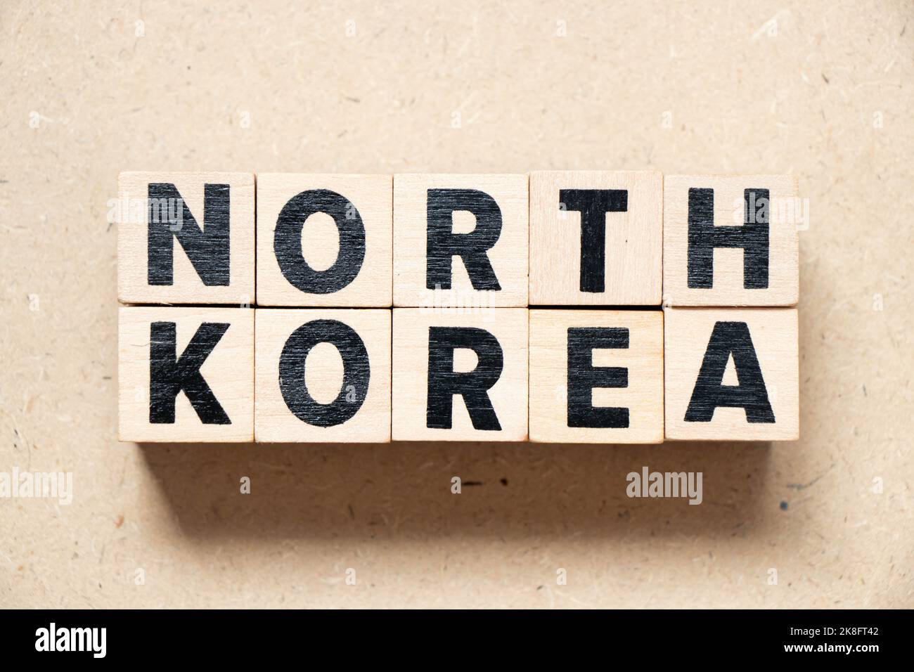 Alphabet letter block in word north korea on wood background Stock ...