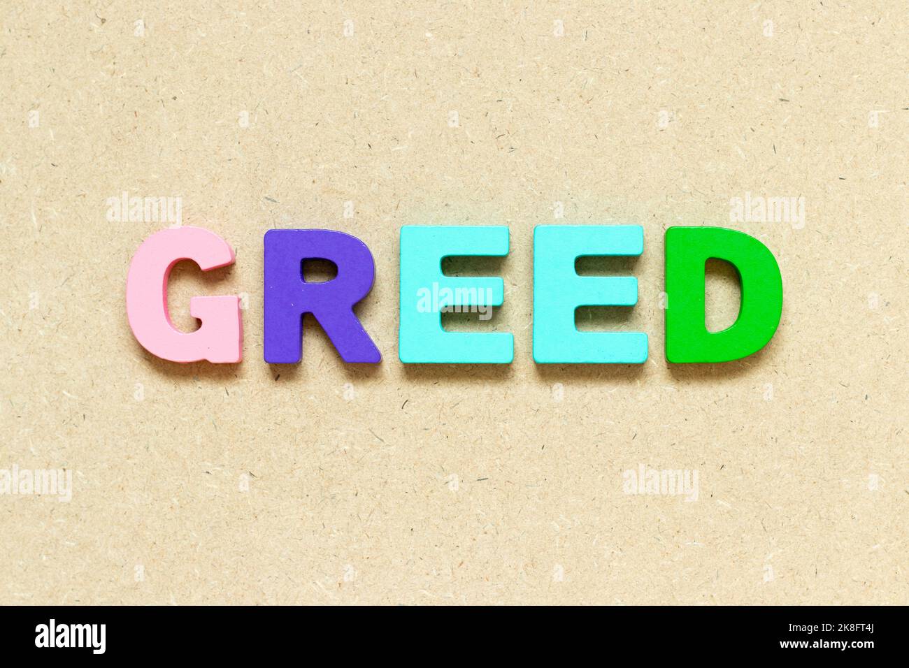 Color alphabet letter with word greed on wood background Stock Photo ...