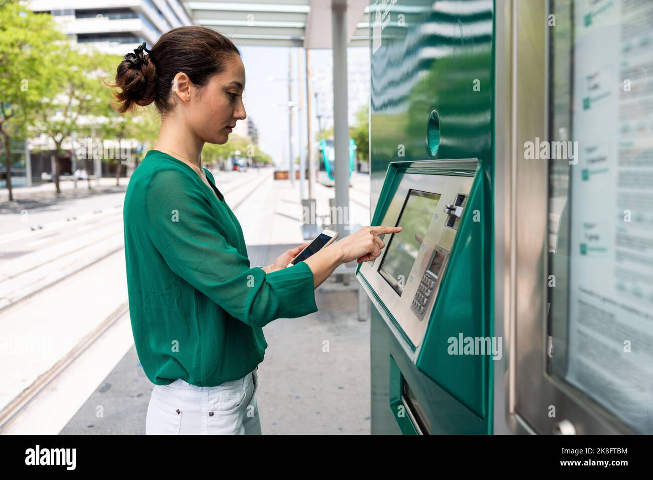 Person using ticket machine station hi-res stock photography and images ...
