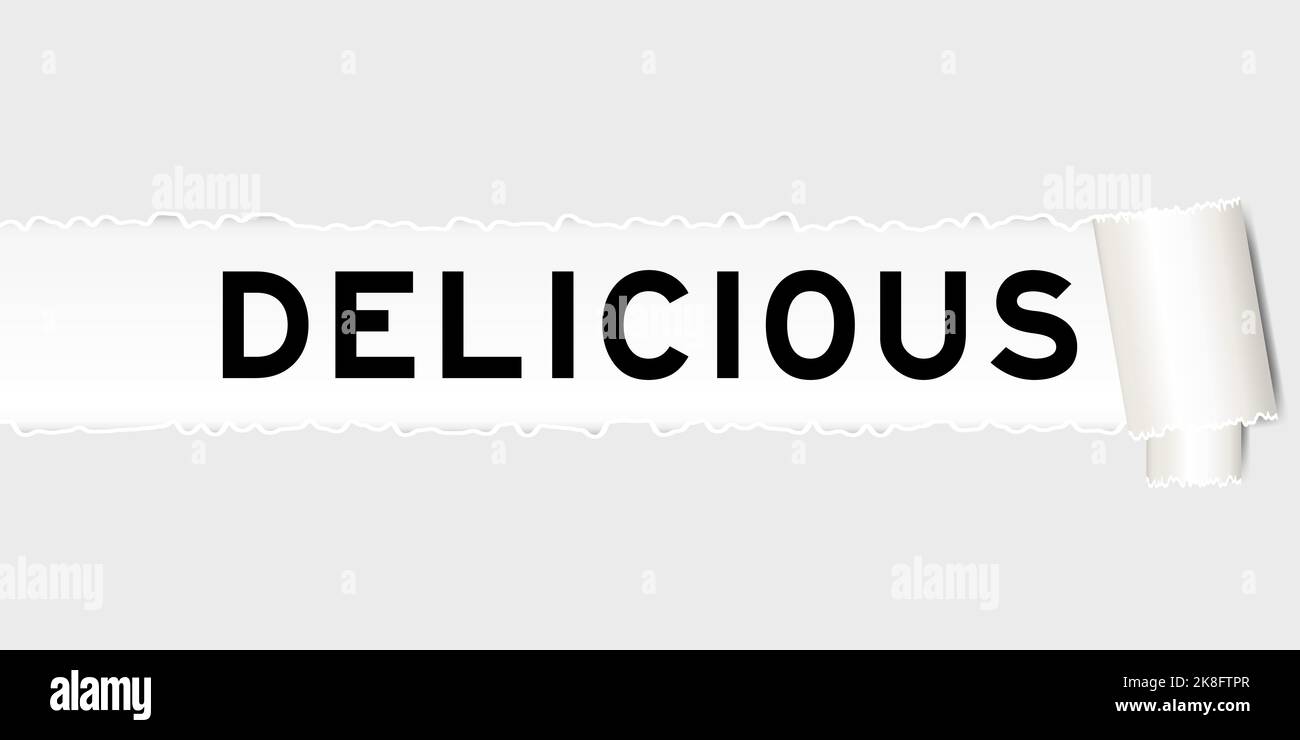 Ripped gray paper background that have word delicious under torn part ...