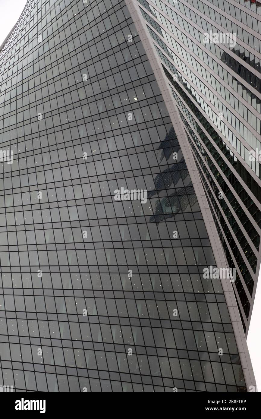 Facade of modern high-rise building with glass windows. Texture of ...