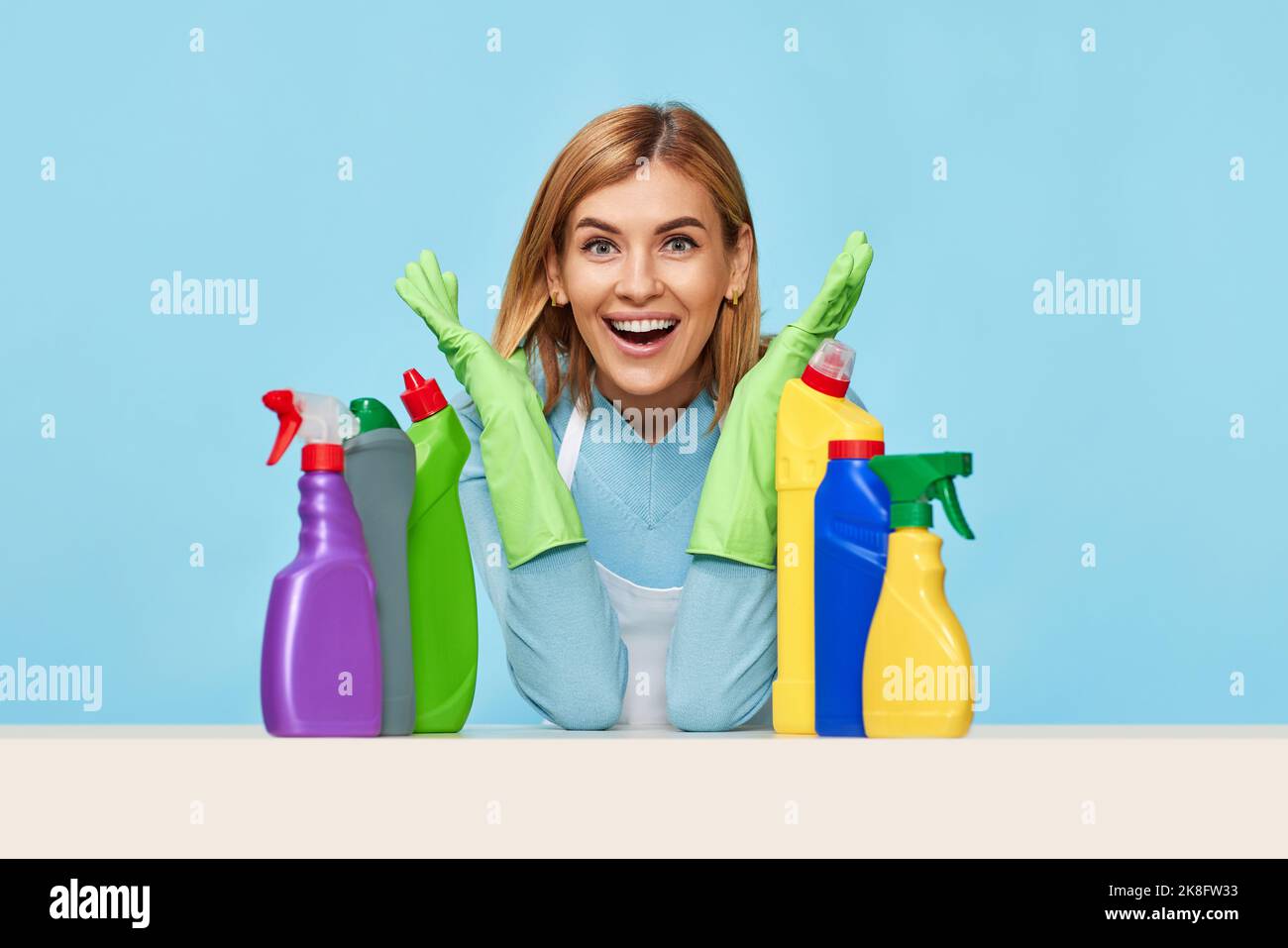 blonde young woman surrounded with cleaning agents Stock Photo - Alamy