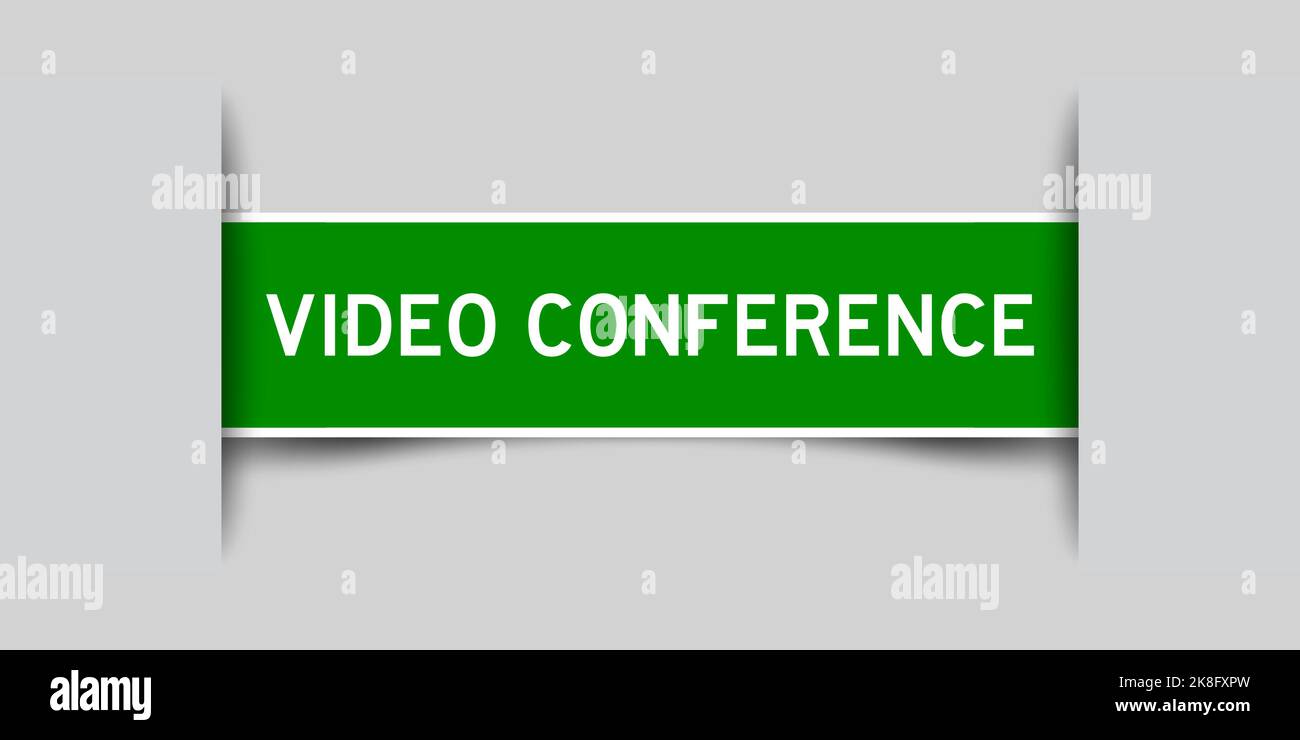 Inserted green color label sticker with word video conference on gray ...
