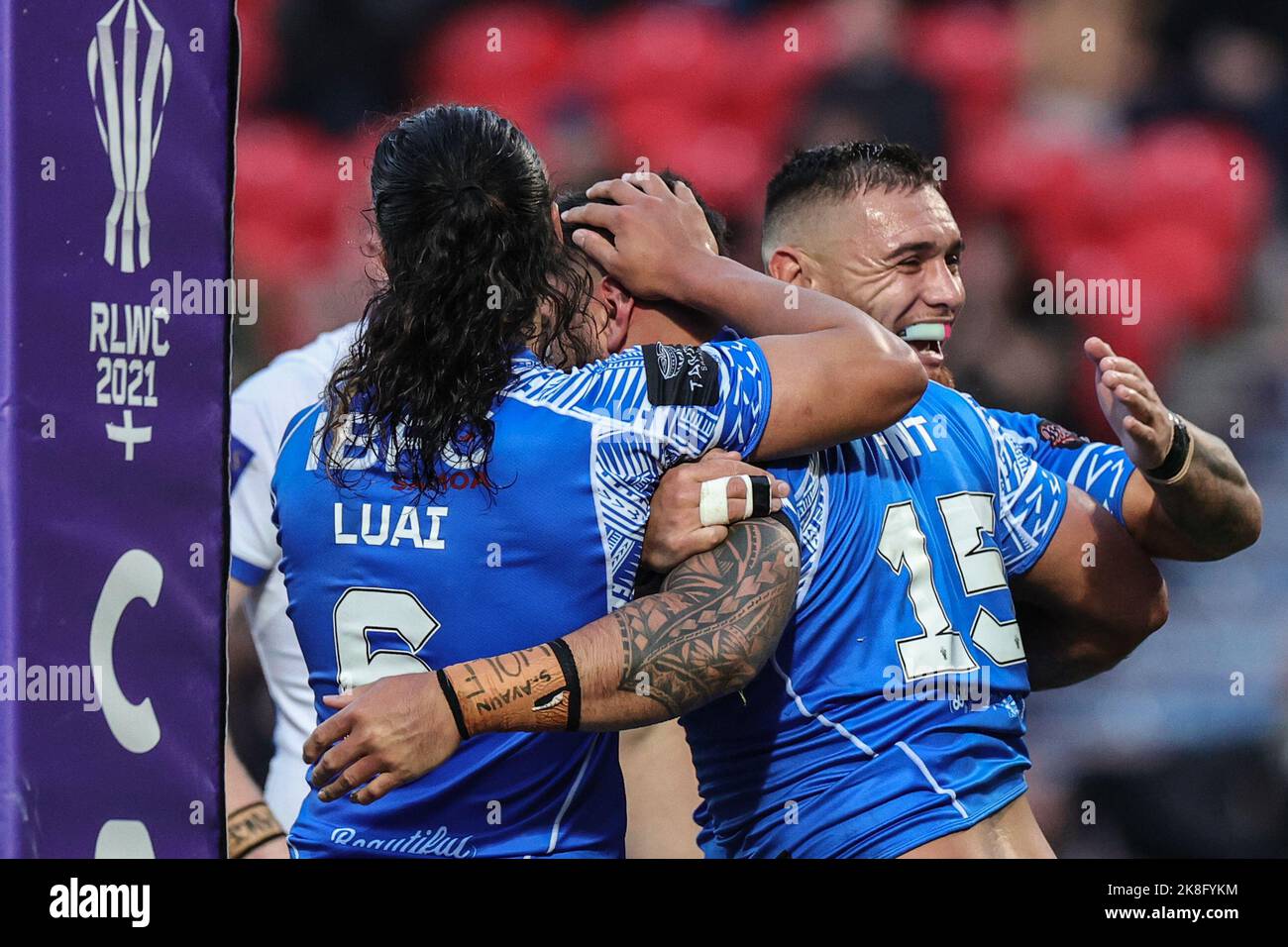 Royce Hunt of Samoa celebrates his try with team mates during the Rugby ...
