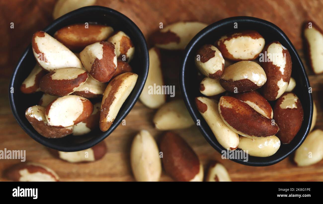 Macro. Large brazil nuts in a bowl. Peeled nuts Stock Photo - Alamy