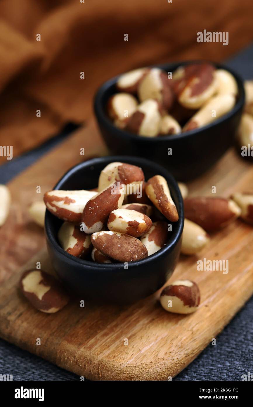 Macro. Large brazil nuts in a bowl. Peeled nuts Stock Photo - Alamy