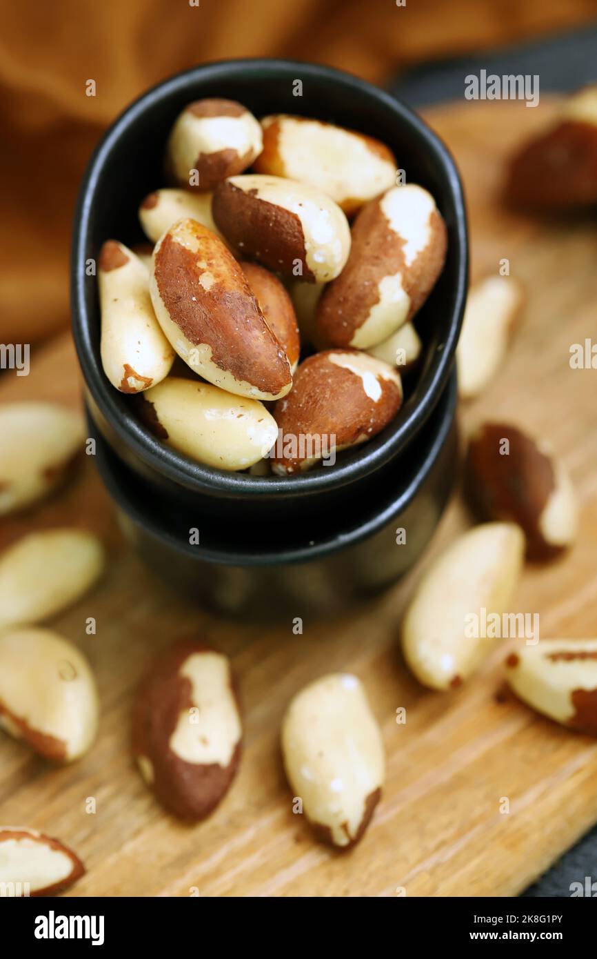 Macro. Large brazil nuts in a bowl. Peeled nuts Stock Photo - Alamy