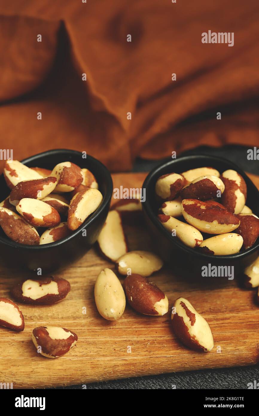 Macro. Large brazil nuts in a bowl. Peeled nuts Stock Photo - Alamy