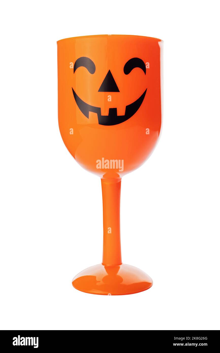 A cute orange cup with jack-o-lantern face isolated on white background ...