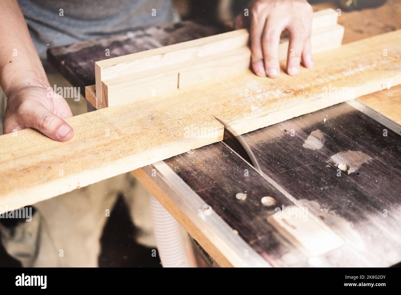 Woodworking operators are using plank cutting machines to assemble and ...