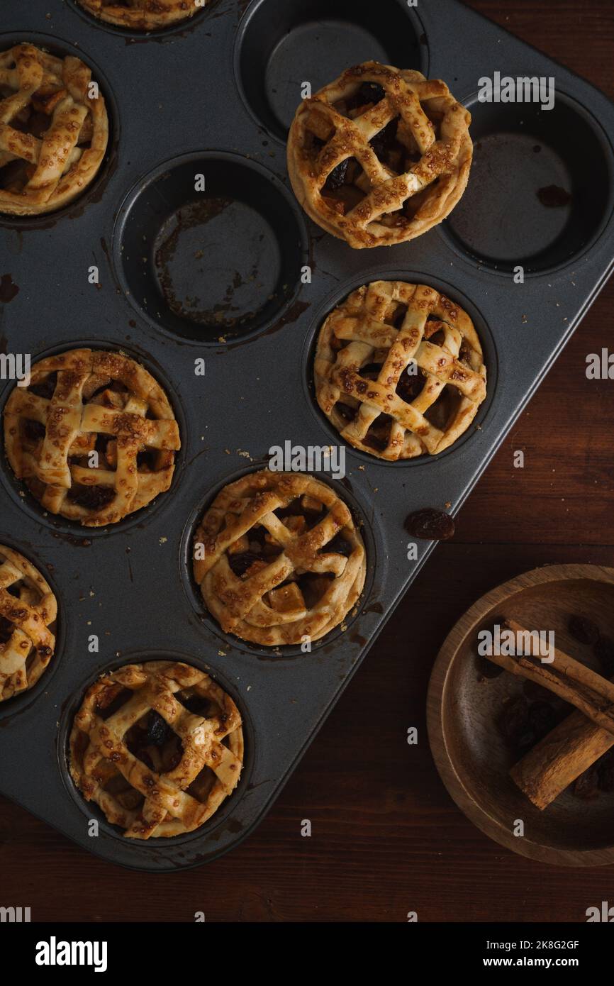 Mini Apple Pie Tarts in dark style food image Stock Photo - Alamy
