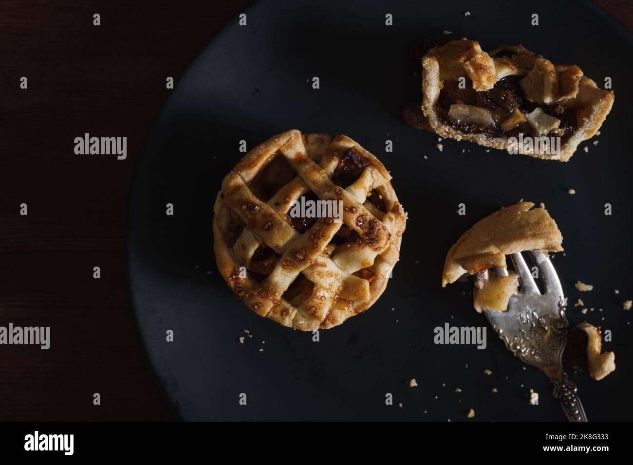 Mini Apple Pie Tarts in dark style food image Stock Photo - Alamy