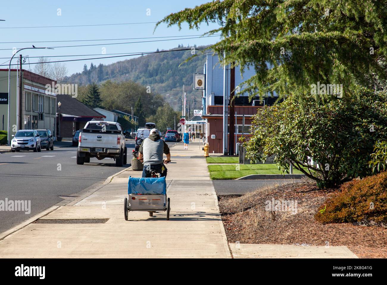 Raymond, WA. USA -10-18-2022: Cyclist with trailer rides down town ...