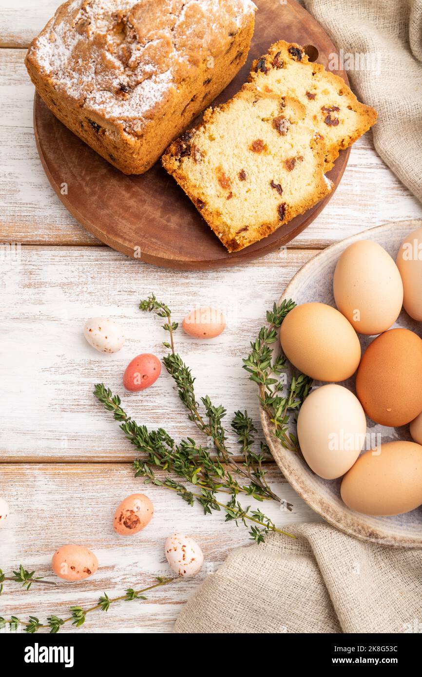 Homemade easter pie with raisins and eggs on plate on a white wooden ...