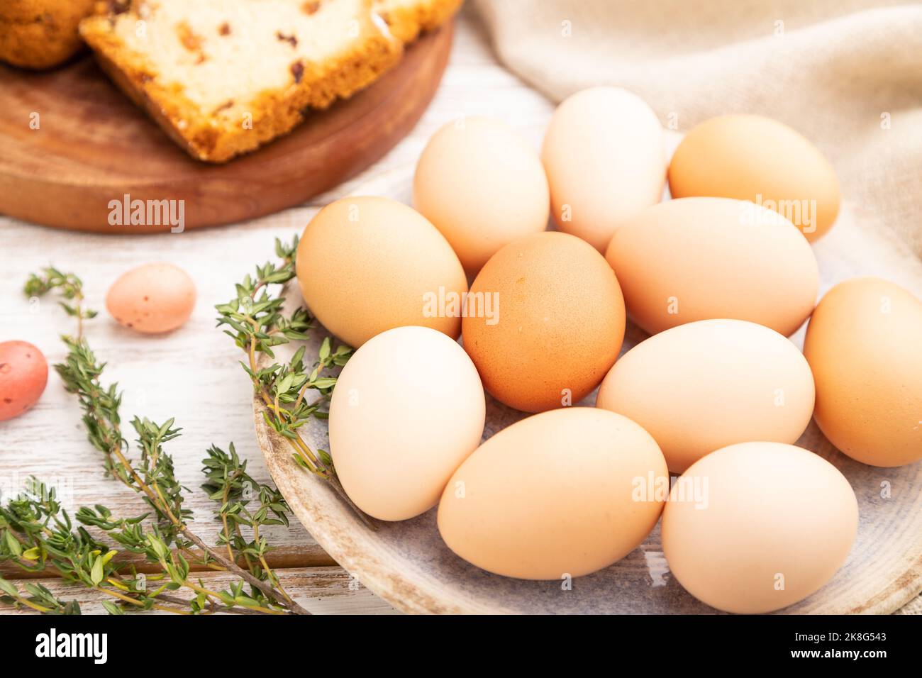 Homemade easter pie with raisins and eggs on plate on a white wooden ...