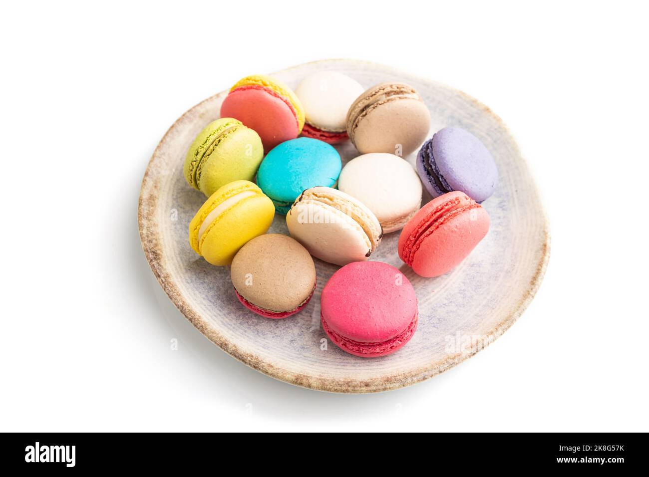 Multicolored macaroons on ceramic plate isolated on white background ...