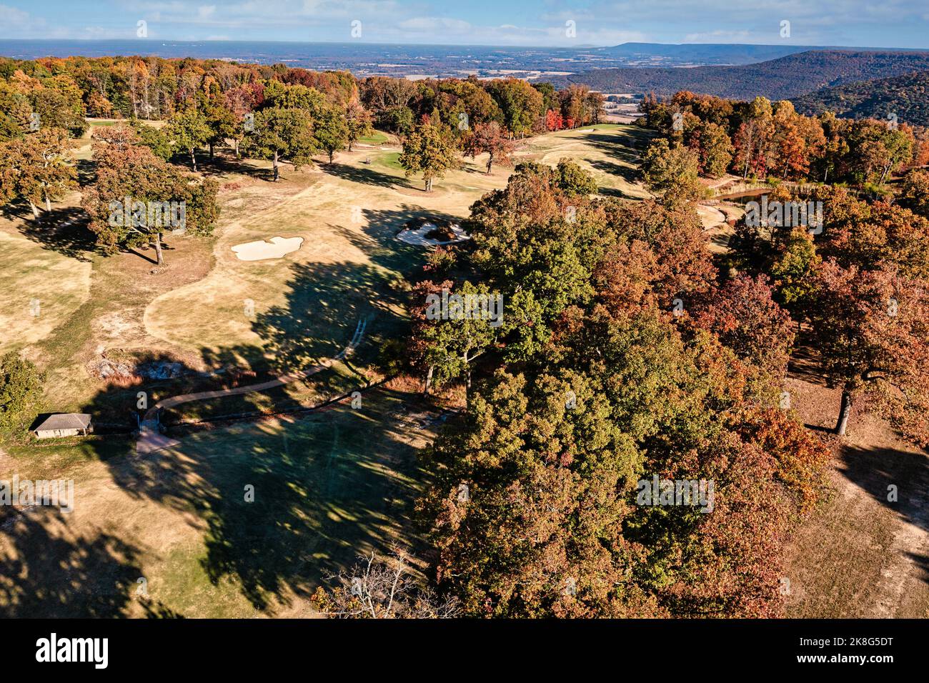 Aerial view of a mountain top golf course with a valley view in the ...