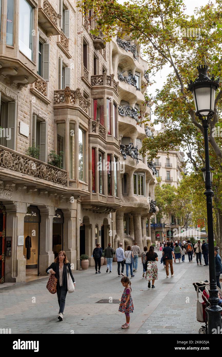 Pedestrians walking down the famous Passeig de Gracia street in ...