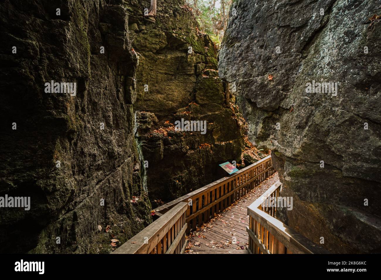wooden pathway between big rocks or cliffs Stock Photo - Alamy